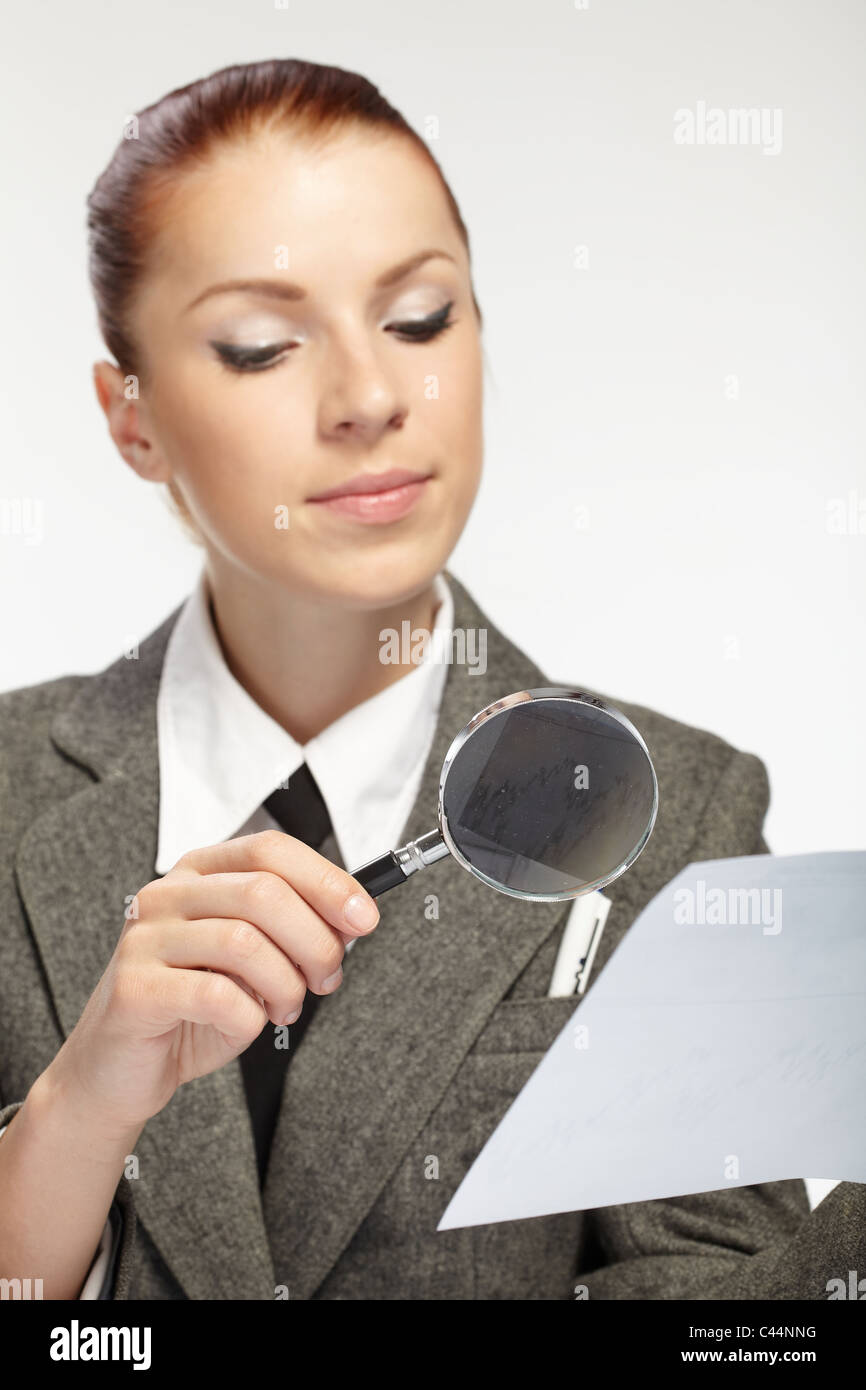 woman holding a magnifying glass in the hand Stock Photo - Alamy