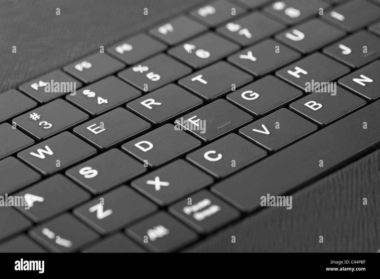Technology background: Macro of laptop keyboard. Shallow depth of field ...