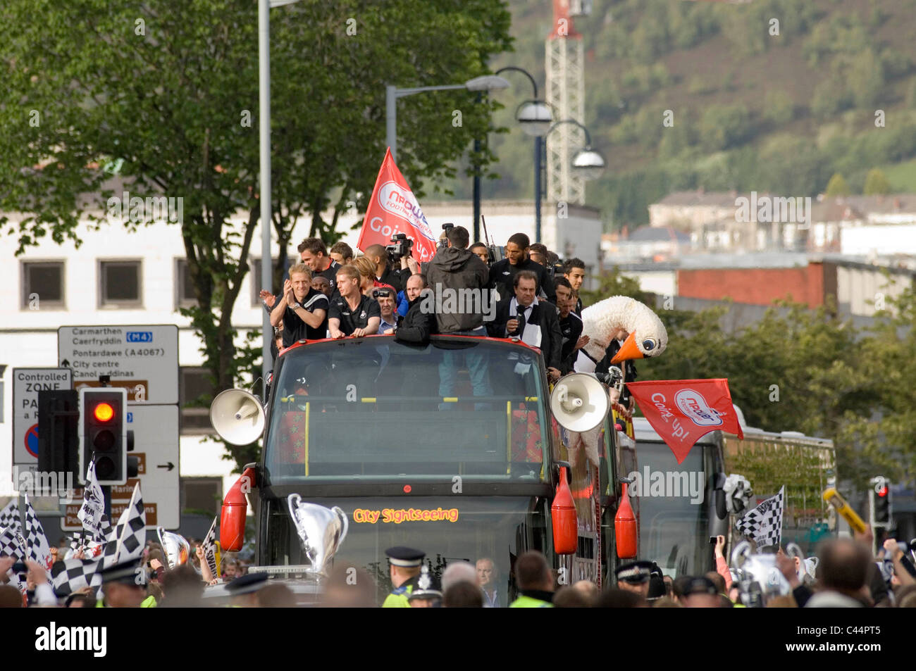 Swansea City Football Club players and staff celebrating their ...