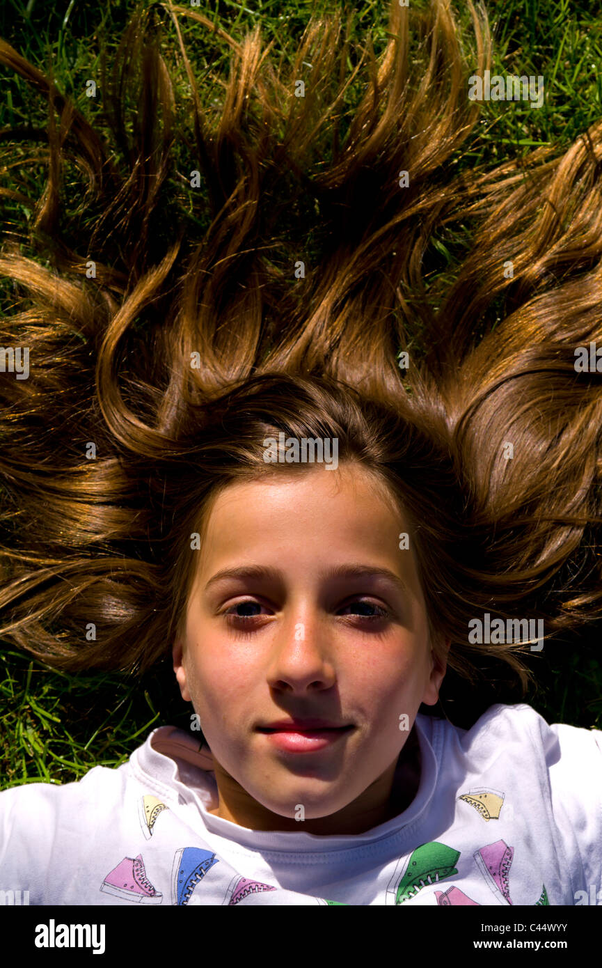 Child, girl, female, lying, ground, hair, splayed out, enigmatic Stock ...