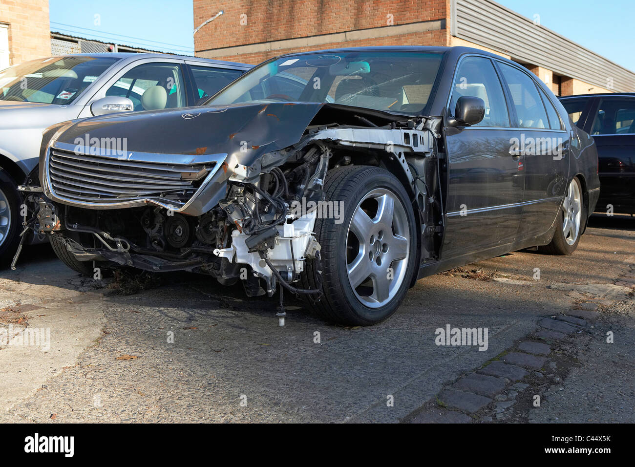 Smashed car in car park Stock Photo - Alamy