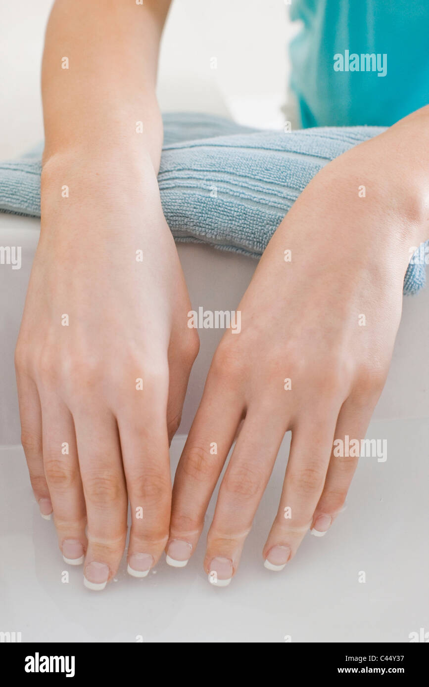 Woman soaking hands Stock Photo - Alamy