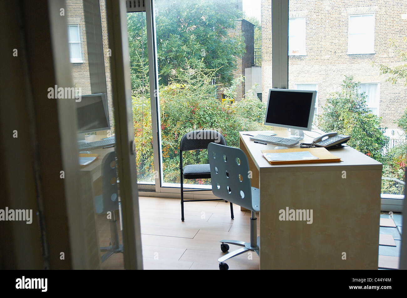 Office desk by window Stock Photo - Alamy