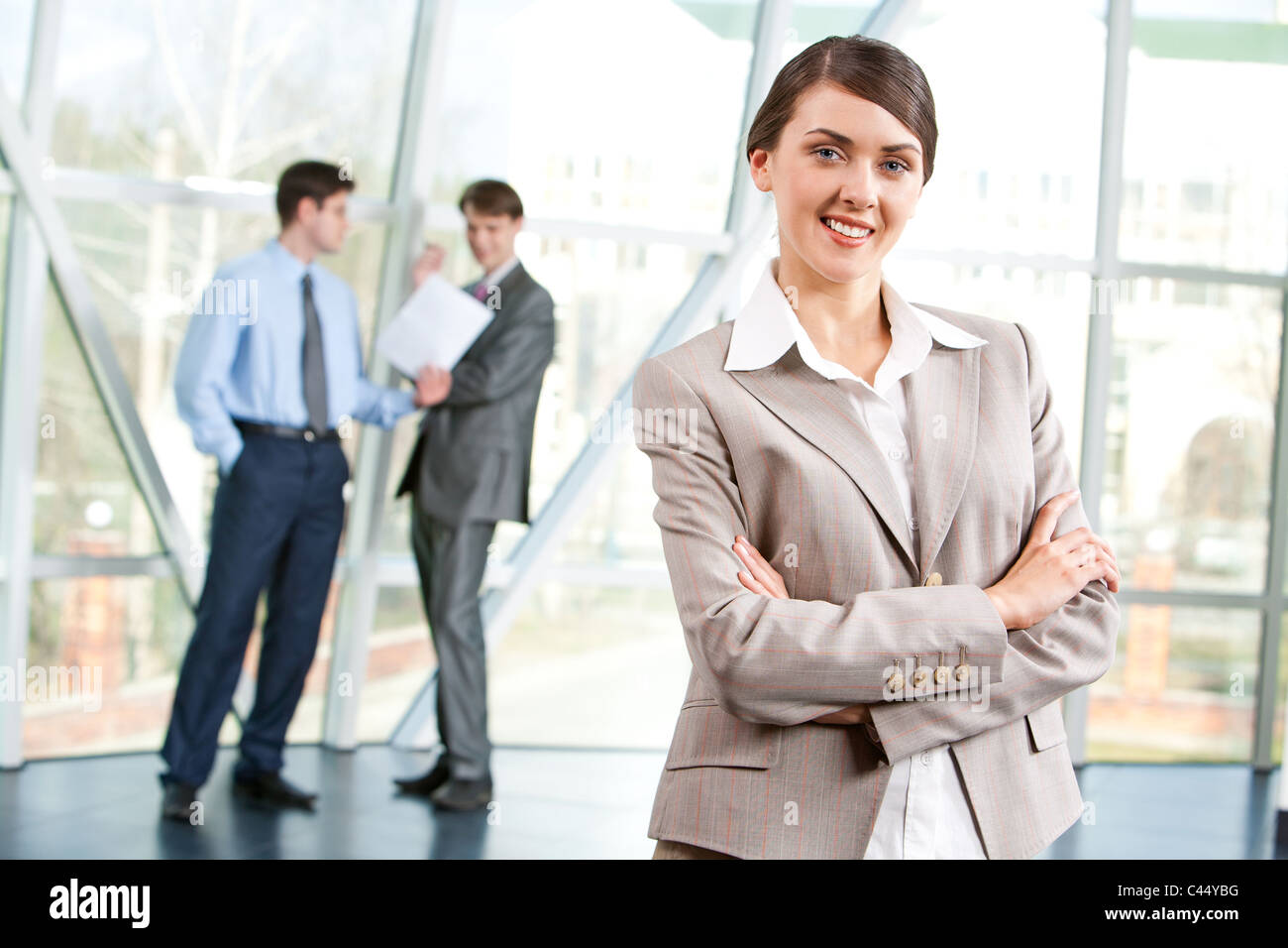 Image of confident secretary standing in the office Stock Photo - Alamy