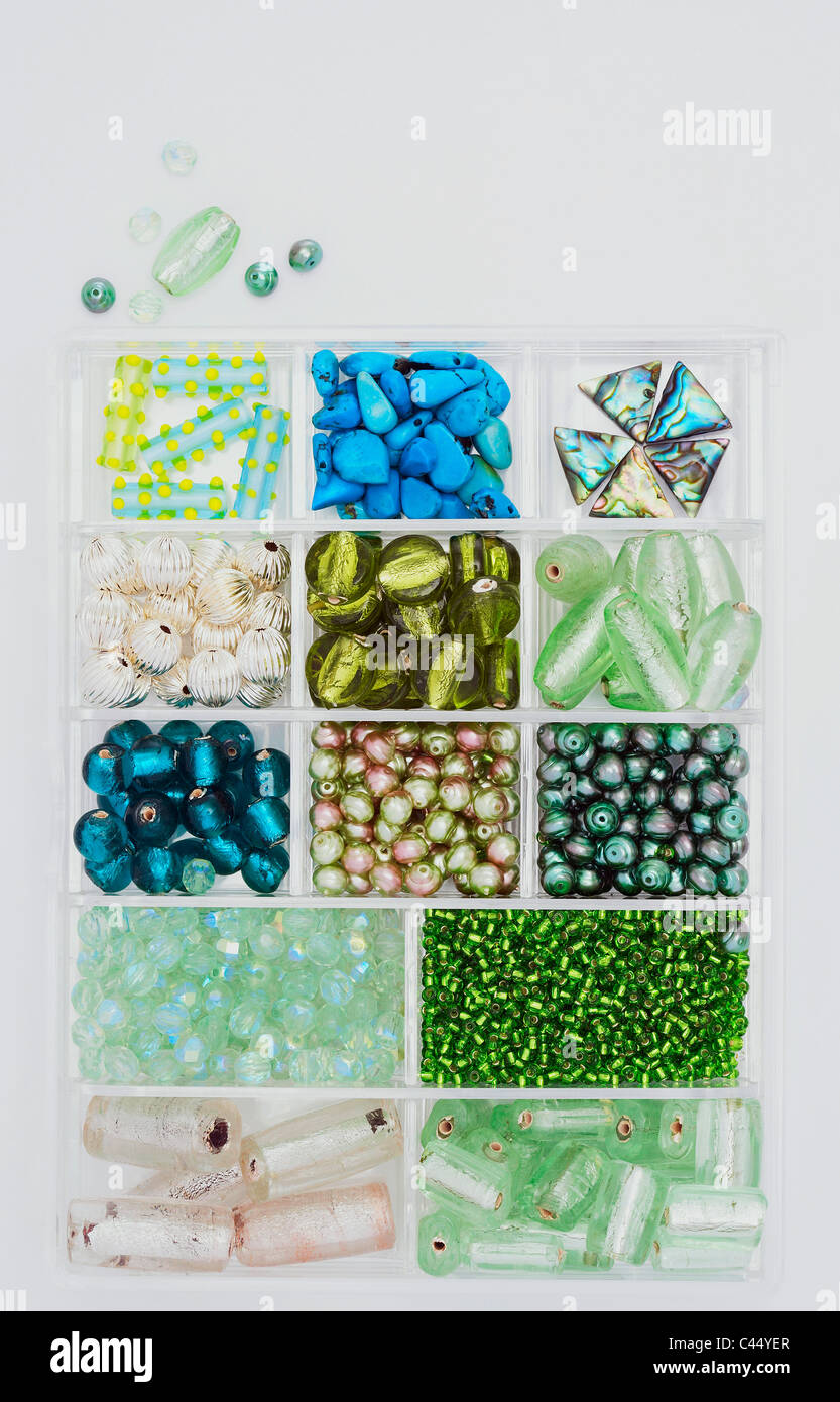 Bead box with variety of blue and green beads Stock Photo - Alamy