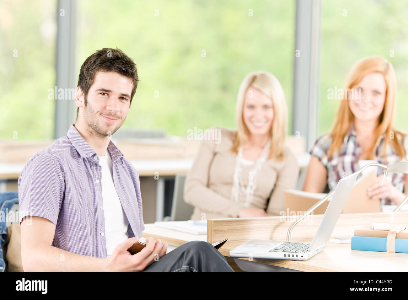 Group of young high school students learning relaxing with books Stock ...
