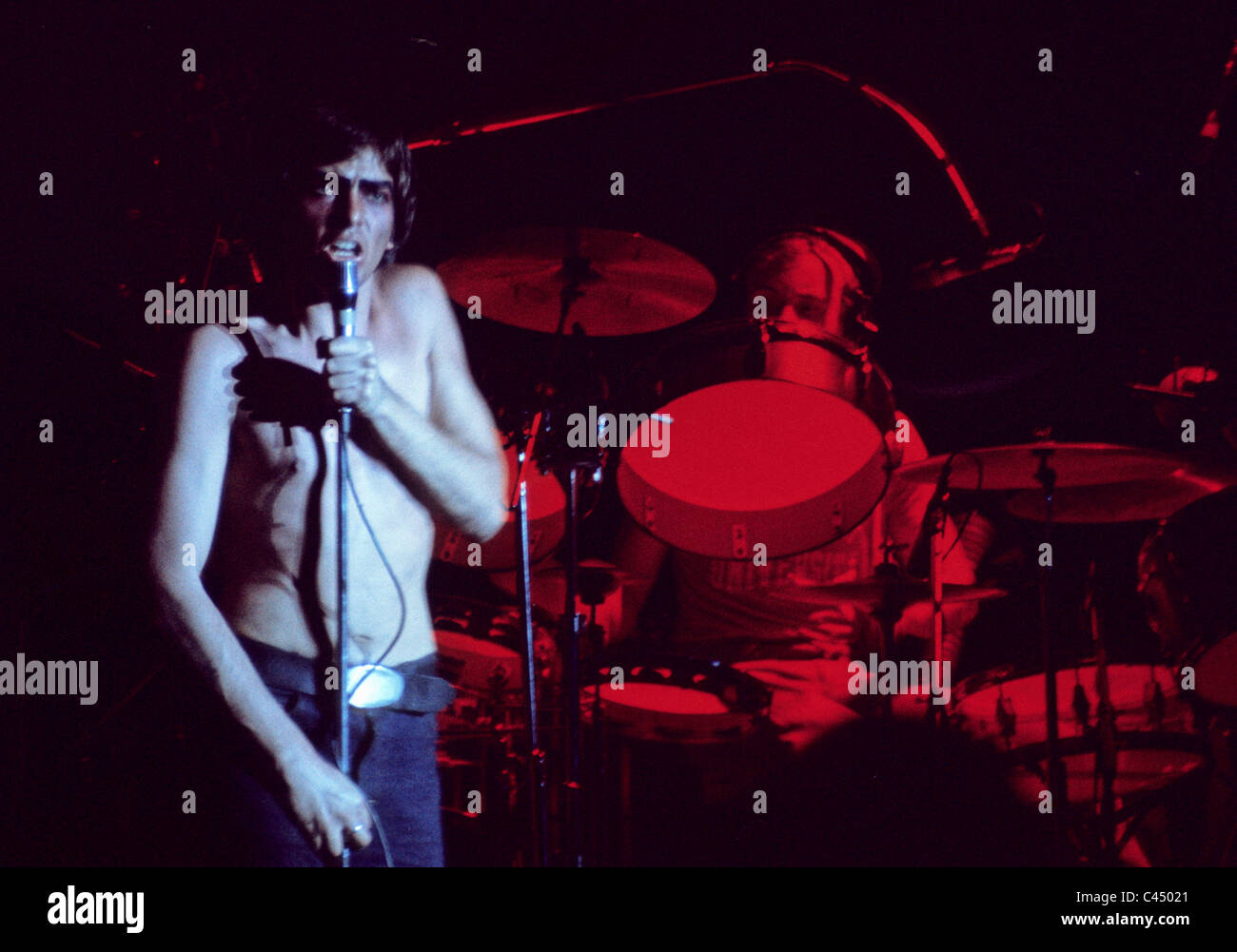 Peter Gabriel and Phil Collins of the progressive rock band Genesis in concert, 1975 Stock Photo ...