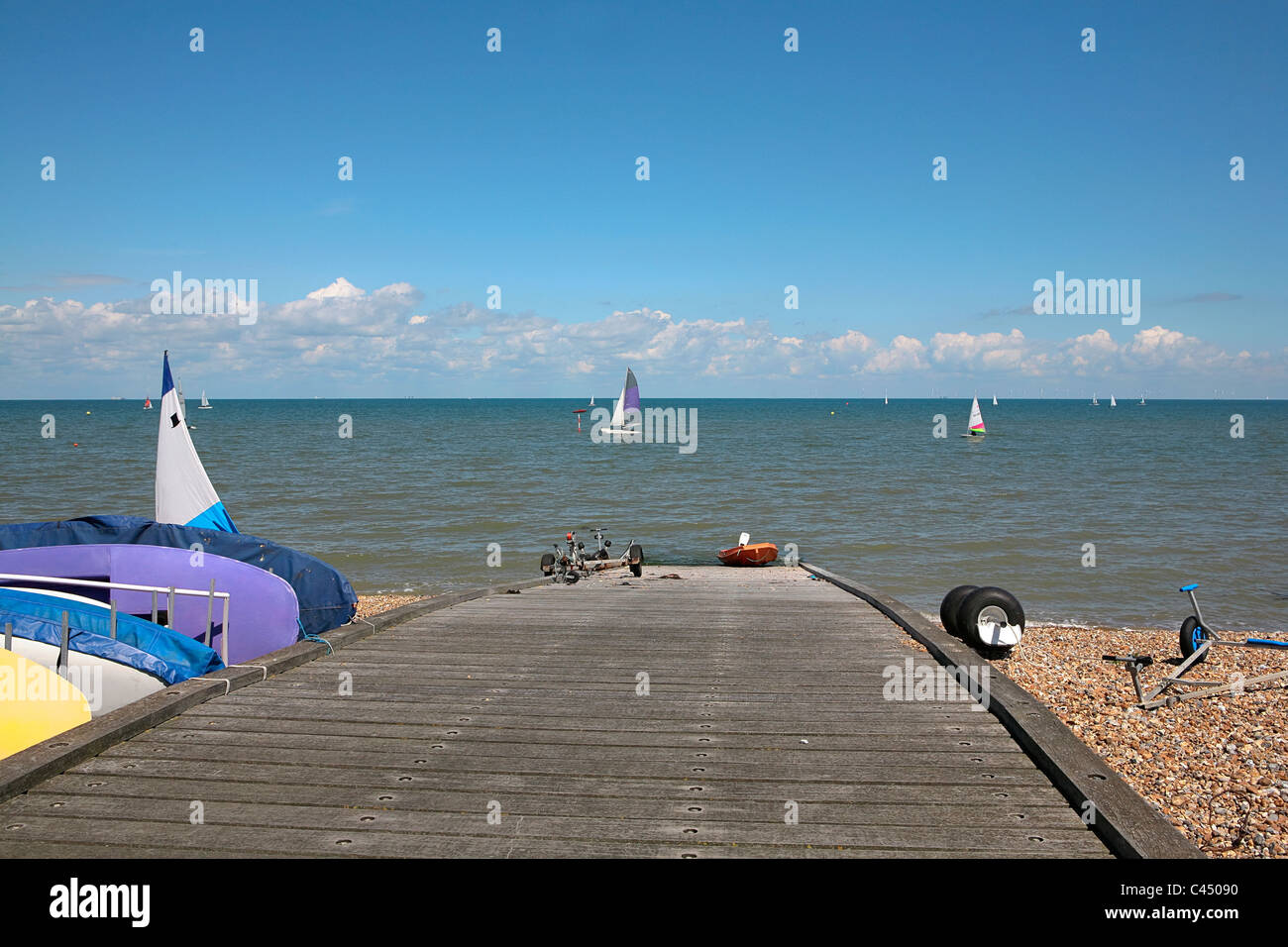 UK, England, Kent, Whitstable, Pier on beach with sailboats in ...
