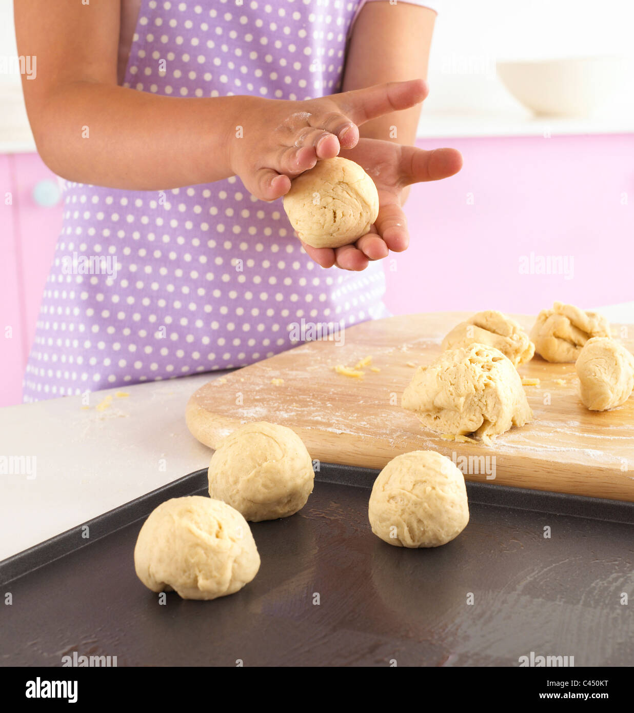 Girl making cheese bread rolls, close-up Stock Photo - Alamy