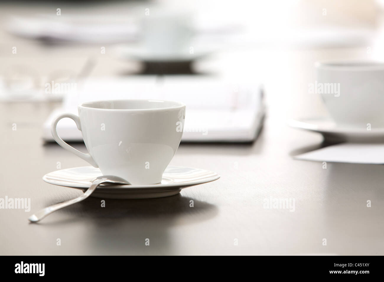 Morning workplace: cup of coffee and business objects on the table ...