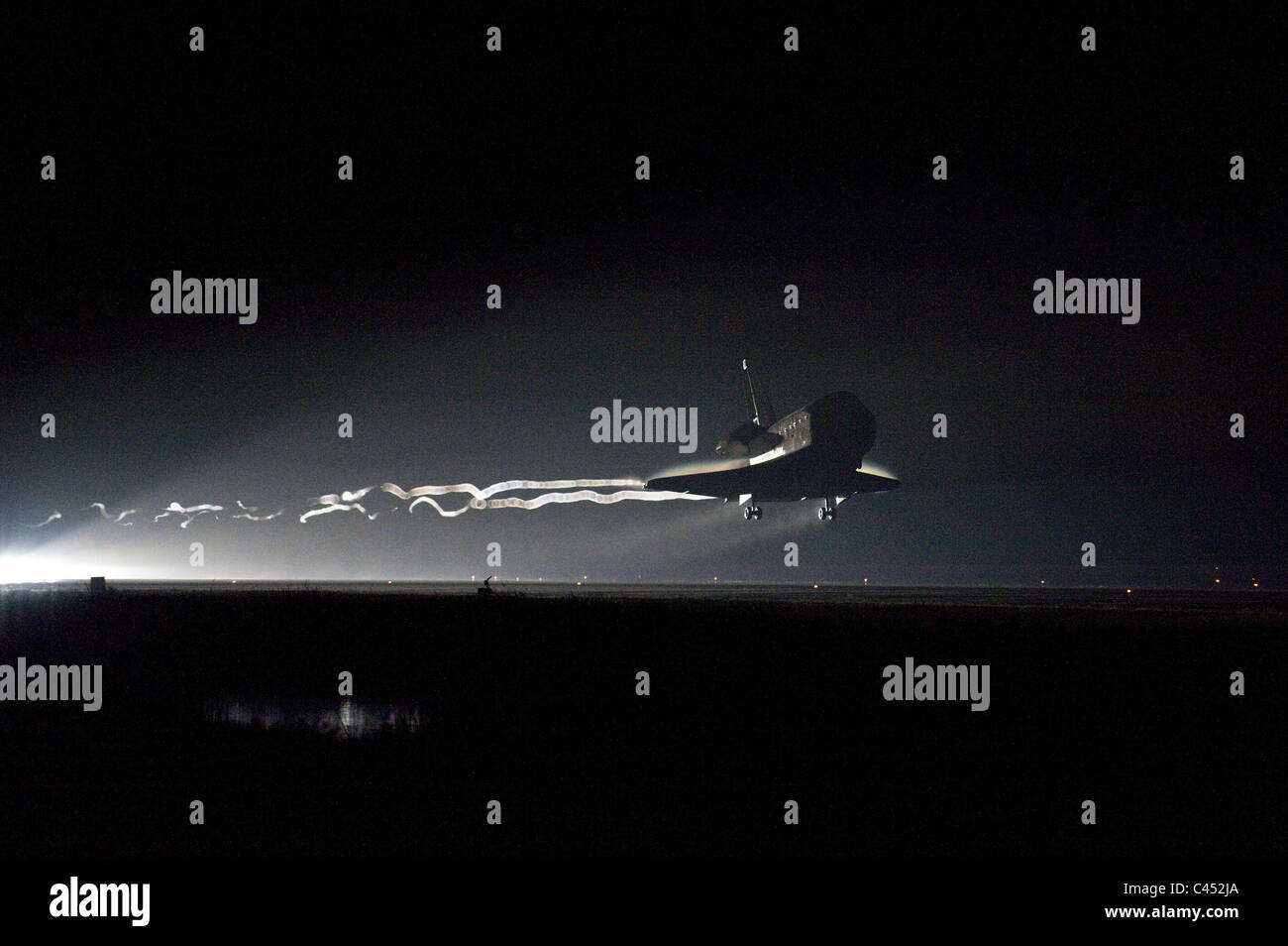 NASA space shuttle Endeavour nighttime landing at the Kennedy Space ...