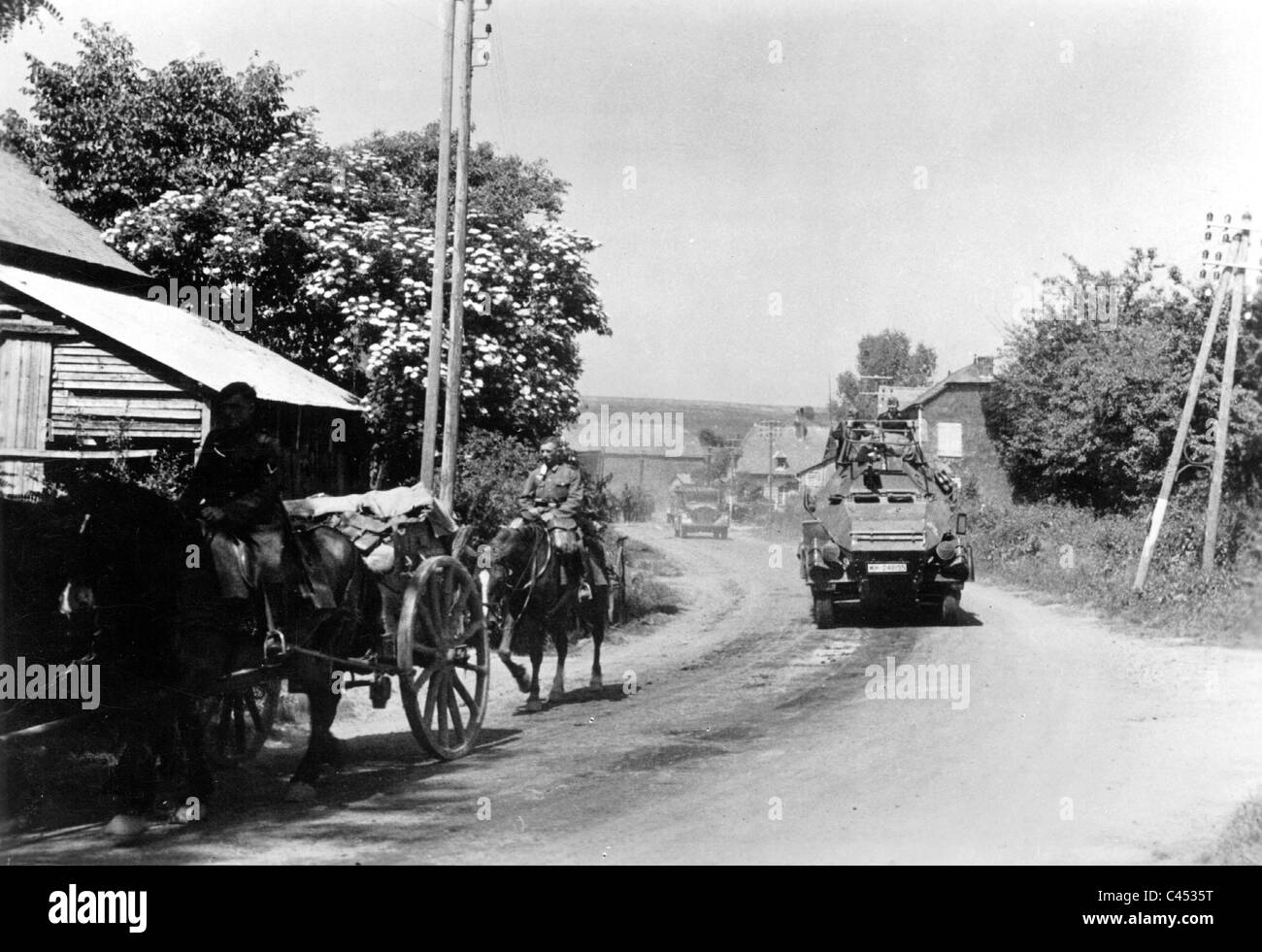 Nazi German troops march through a French town, 1940 Stock Photo - Alamy