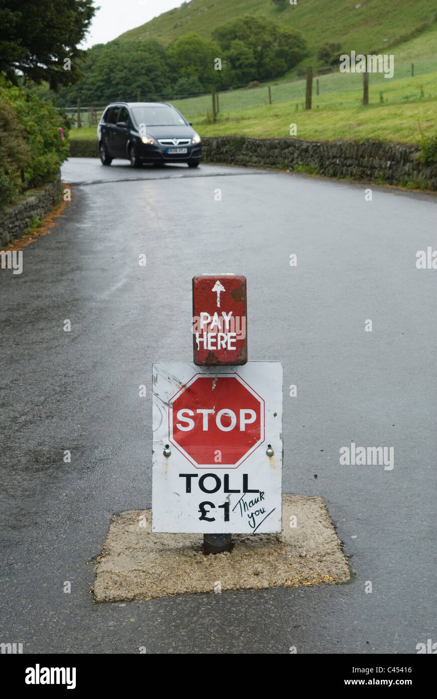 Honesty box toll road pay here sign. North Devon Exmoor UK minor road ...