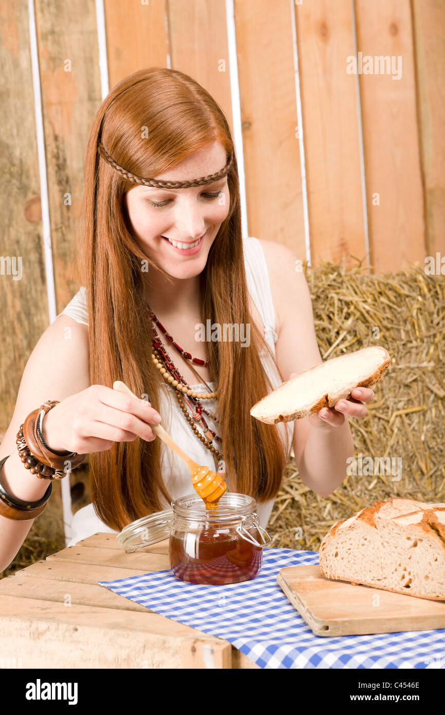 Young red-hair hippie woman have organic breakfast in barn Stock Photo ...