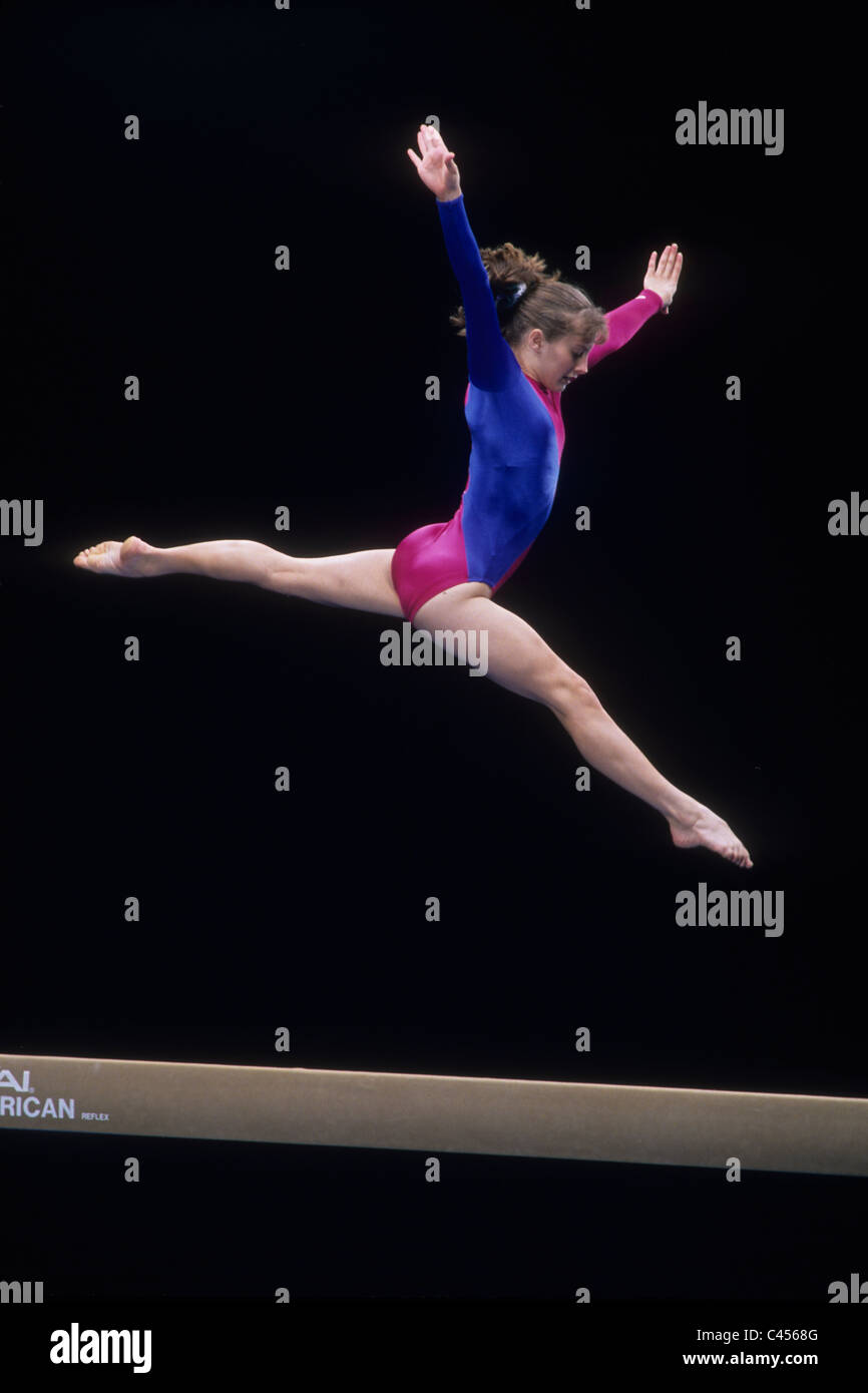 Female gymnast on the balance beam Stock Photo - Alamy