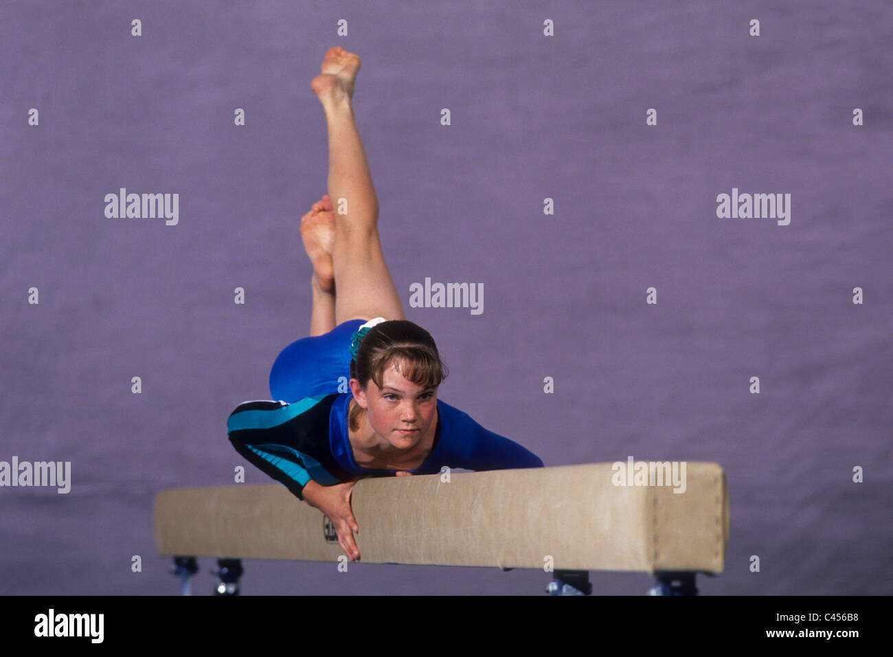 Female gymnast on the balance beam Stock Photo - Alamy