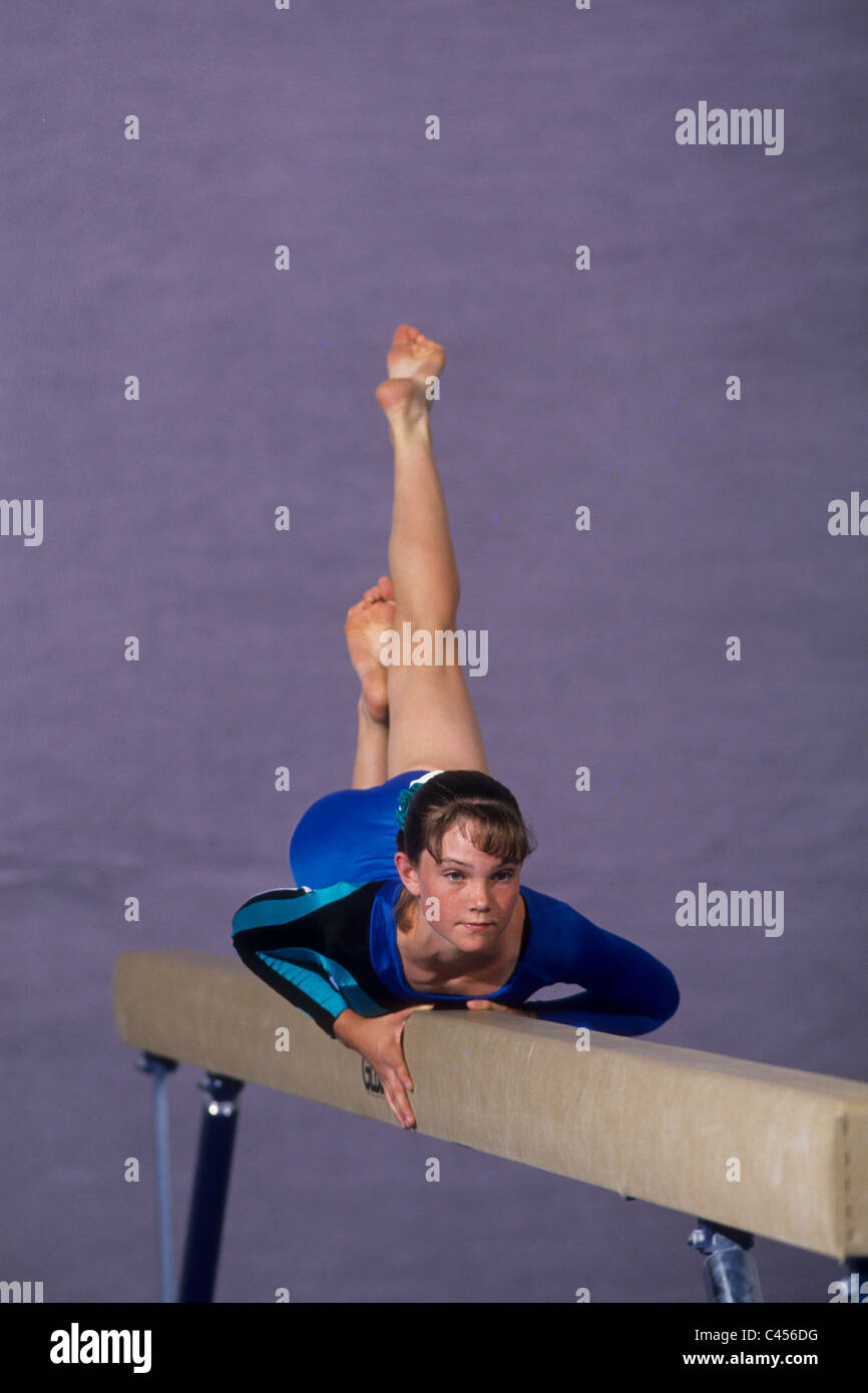 Female gymnast on the balance beam Stock Photo - Alamy