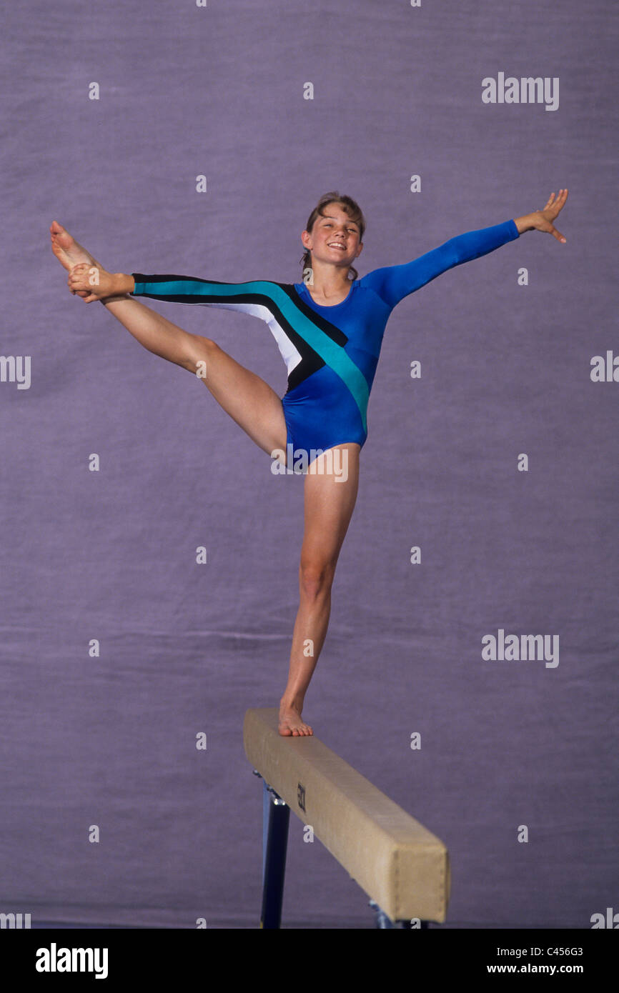 Female gymnast on the balance beam Stock Photo - Alamy