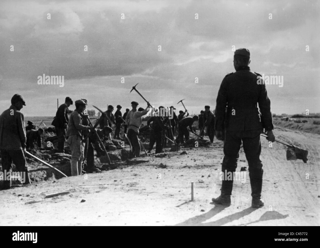 Forced labor road construction Black and White Stock Photos & Images ...
