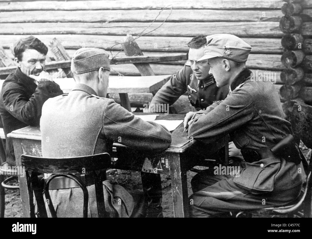 Interrogation of villagers by German soldiers, 1941 Stock Photo - Alamy