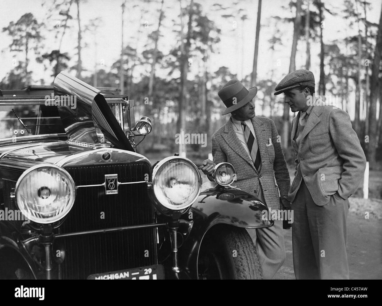 Men talk about a car Stock Photo - Alamy