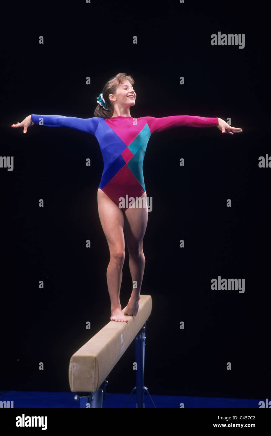 Female gymnast on the balance beam Stock Photo - Alamy