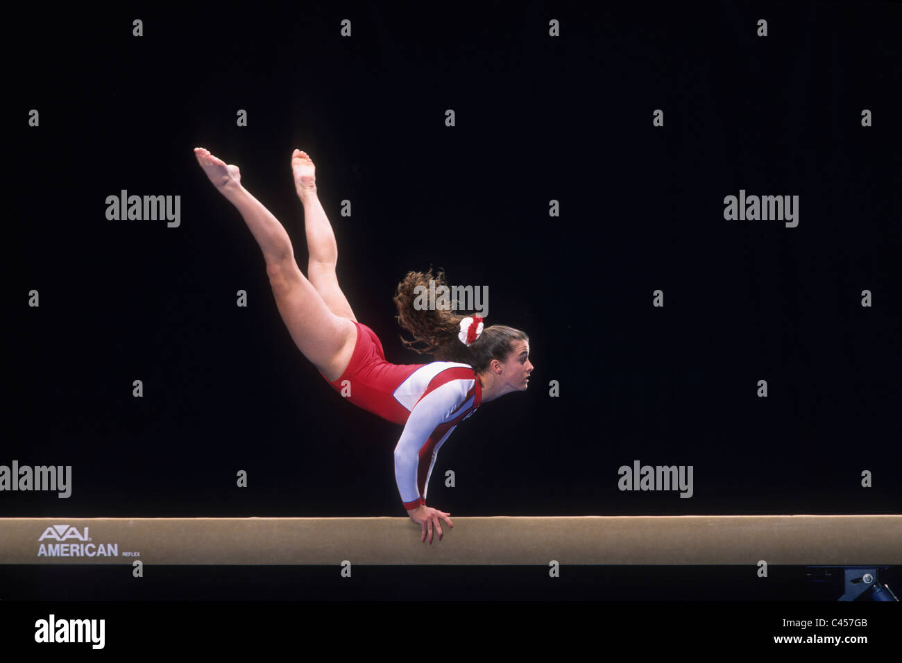 Female gymnast on the balance beam Stock Photo - Alamy