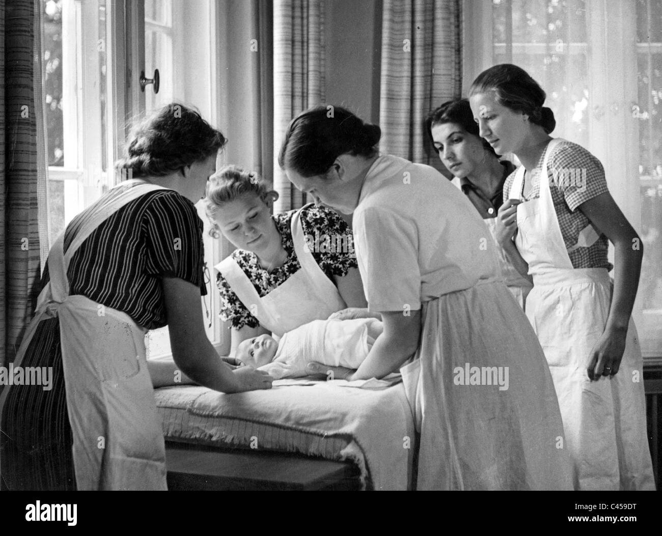 Infant care at the Reich Bridal School, Schwanenwerder, 1938 Stock ...