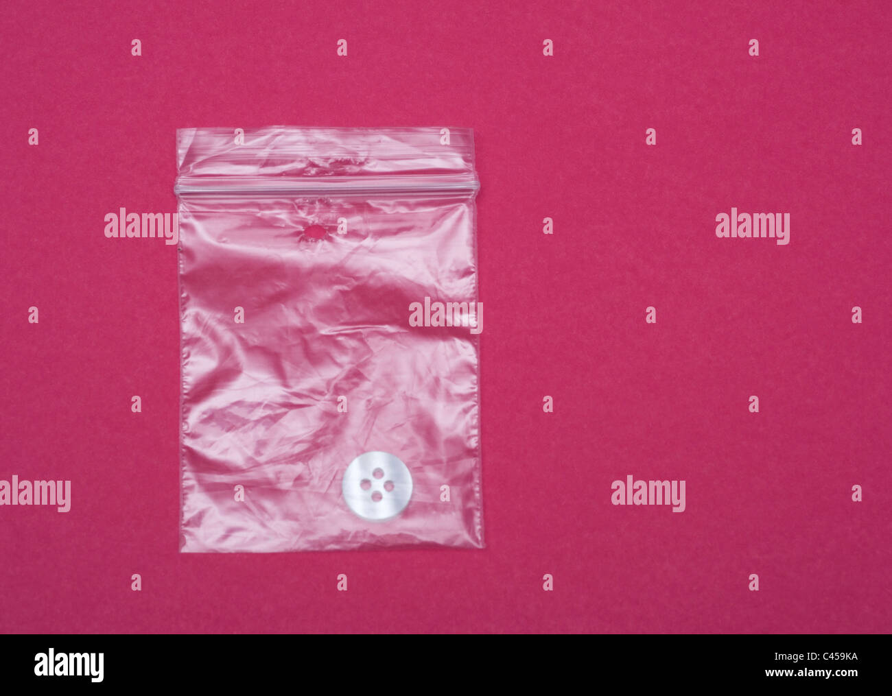 spare button in plastic bag Stock Photo - Alamy