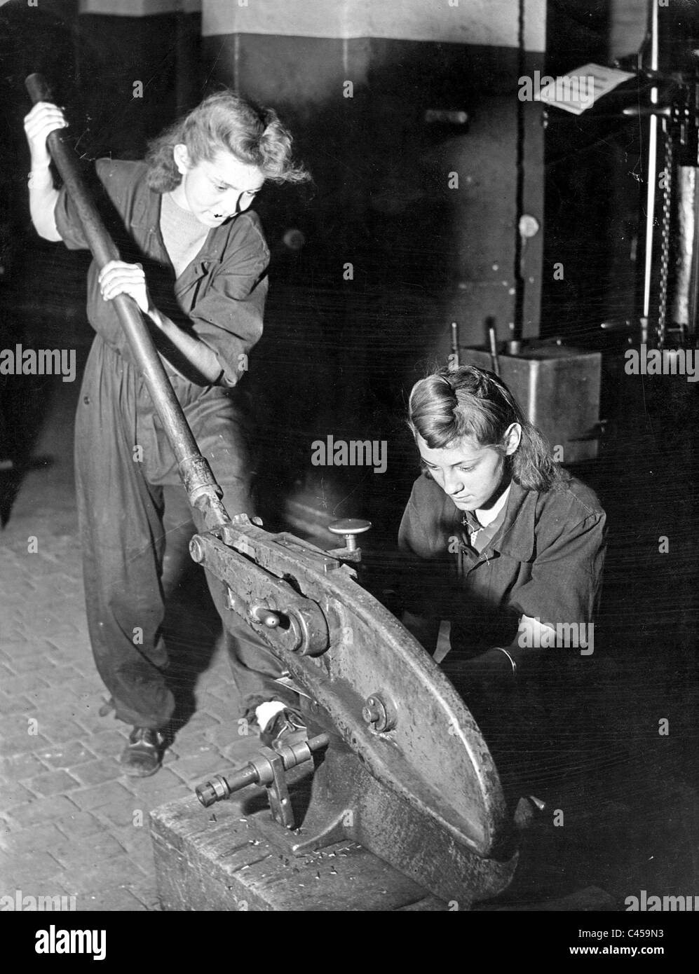 Women in the war auxiliary service at a shipyard in Danzig, 1942 Stock ...
