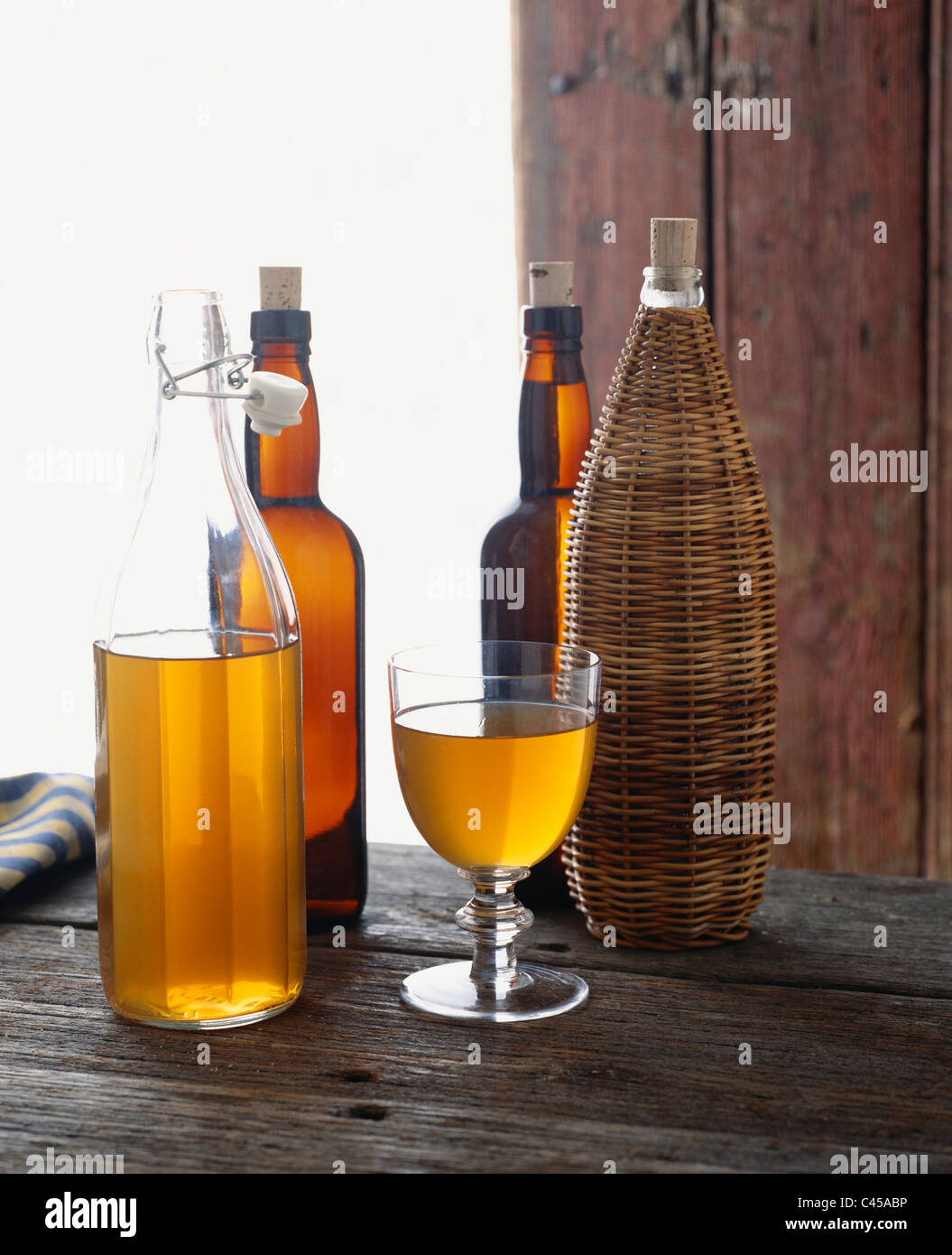Bottles and glass of home-made cider and wines, close-up Stock Photo ...