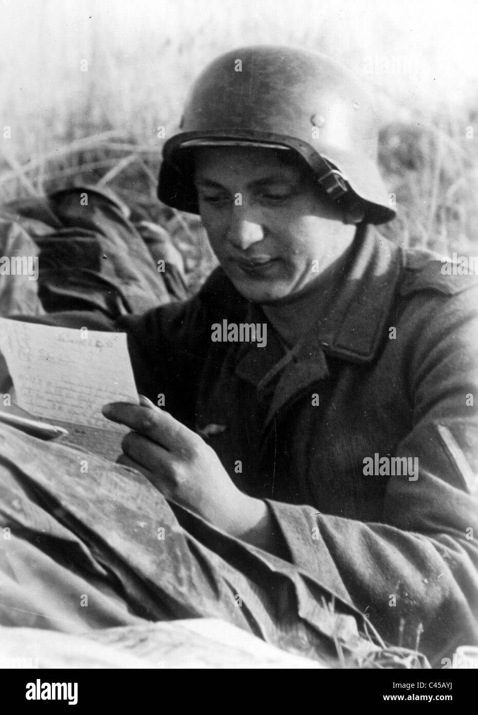 Nazi German soldier read a letter, 1944 Stock Photo - Alamy