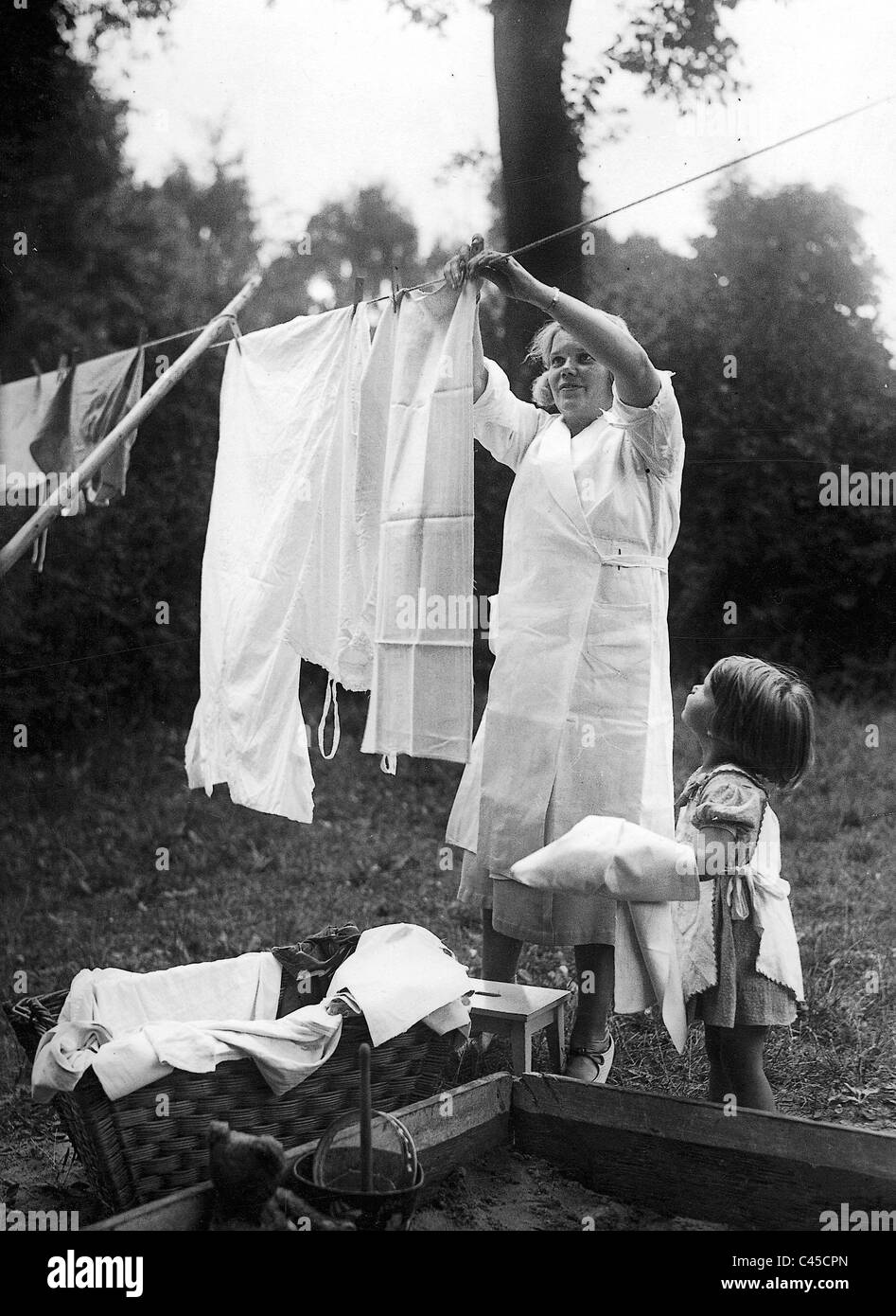 Woman children in garden Black and White Stock Photos & Images - Alamy