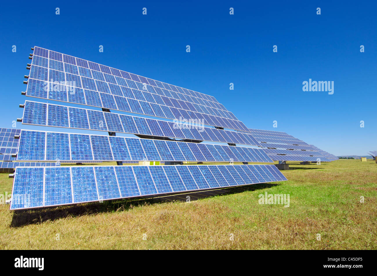 Solar field with blue sky Stock Photo - Alamy