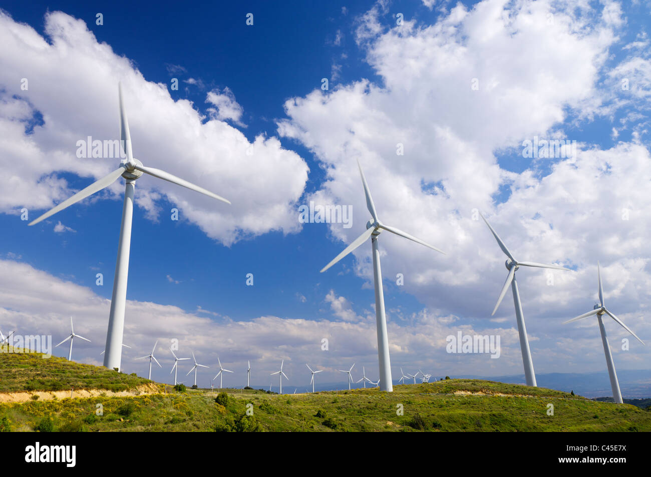 line of wind turbines for electricity production Stock Photo - Alamy