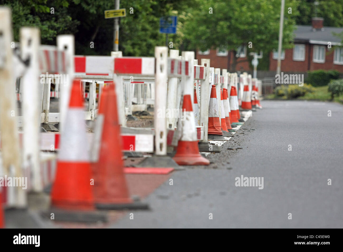 A row of cones and barriers protecting roadworks from vehicles and ...
