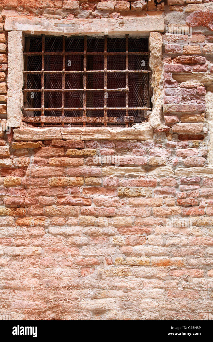 grated window against brick wall Stock Photo - Alamy