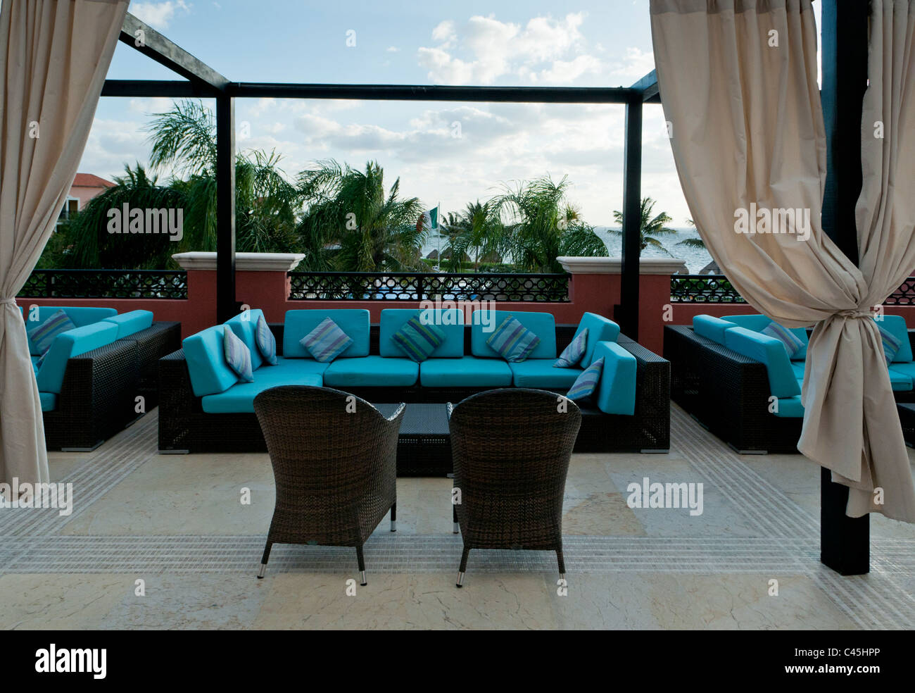 Colorful outdoor seating on an upper deck of a vacation resort along ...