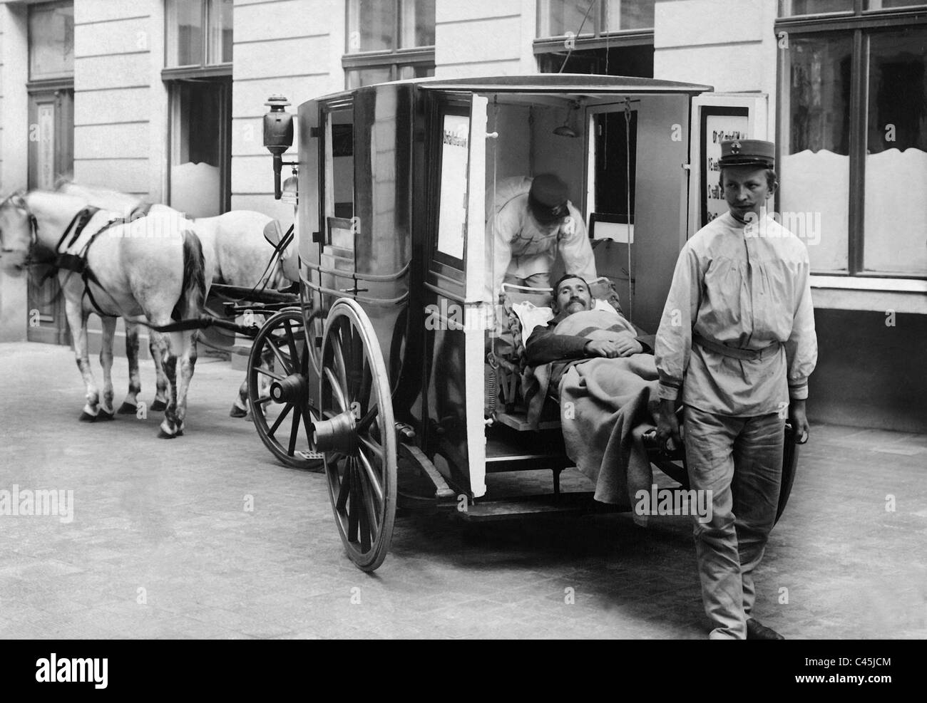 Ambulance service of the Red Cross with a accident victim, 1897 Stock ...