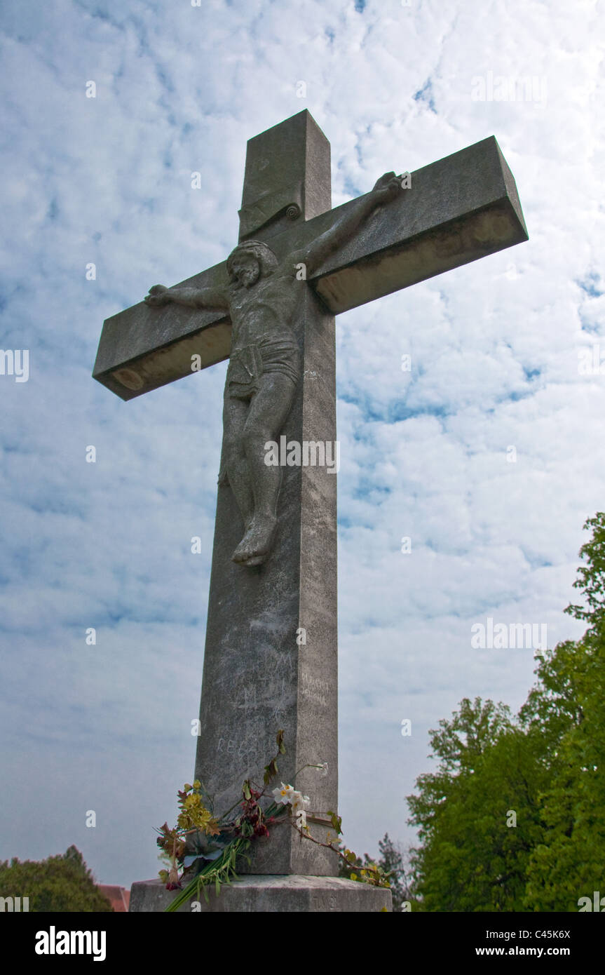 A statue of Jesus Christ crucified against dramatic sky Stock Photo - Alamy
