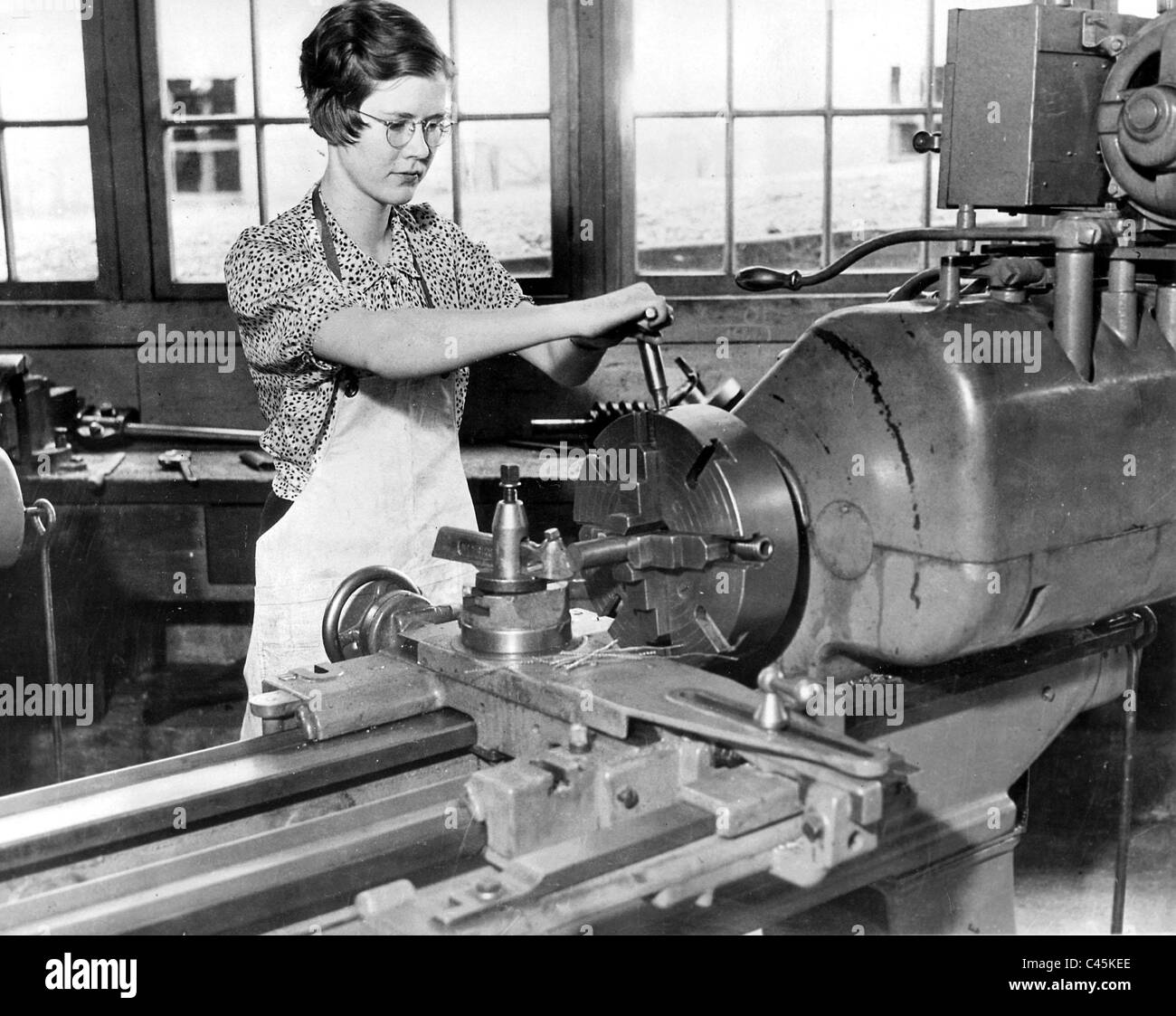 Female mechanic at the work table, 1935 Stock Photo - Alamy