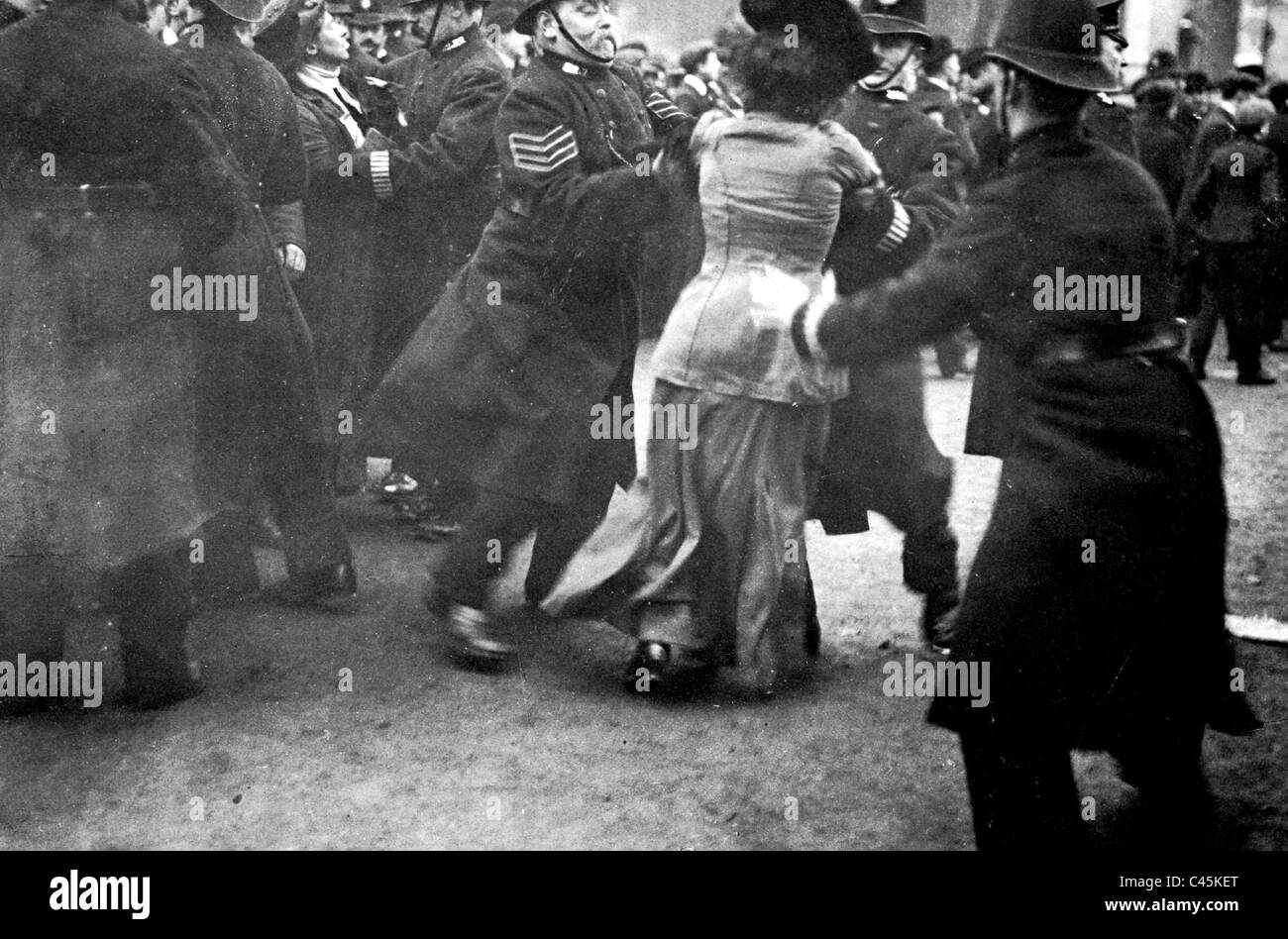 Police arrest a suffragette at a demonstration hi-res stock photography ...
