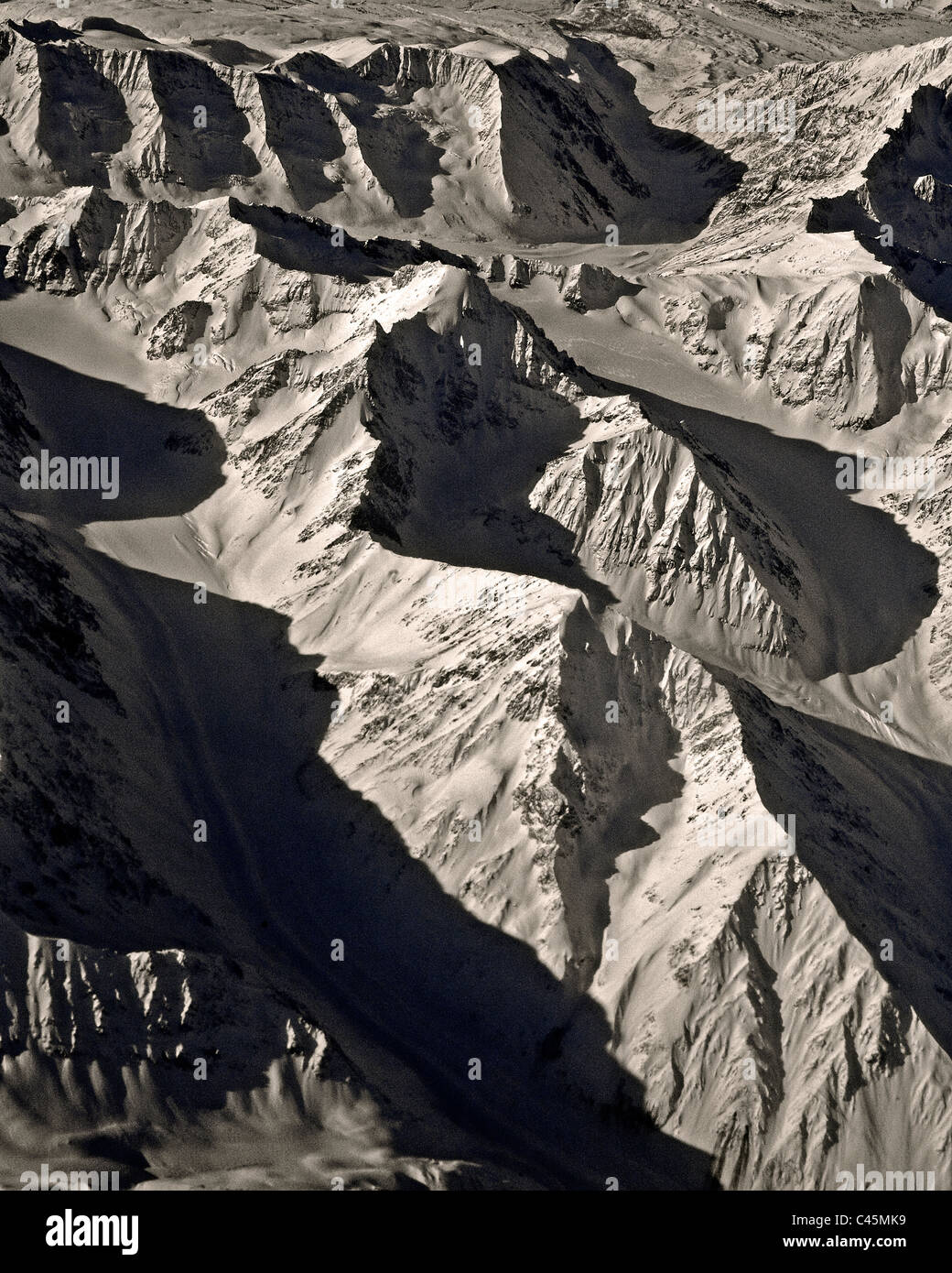 Looking down on Alaska's snow-encrusted coastal range from above in ...