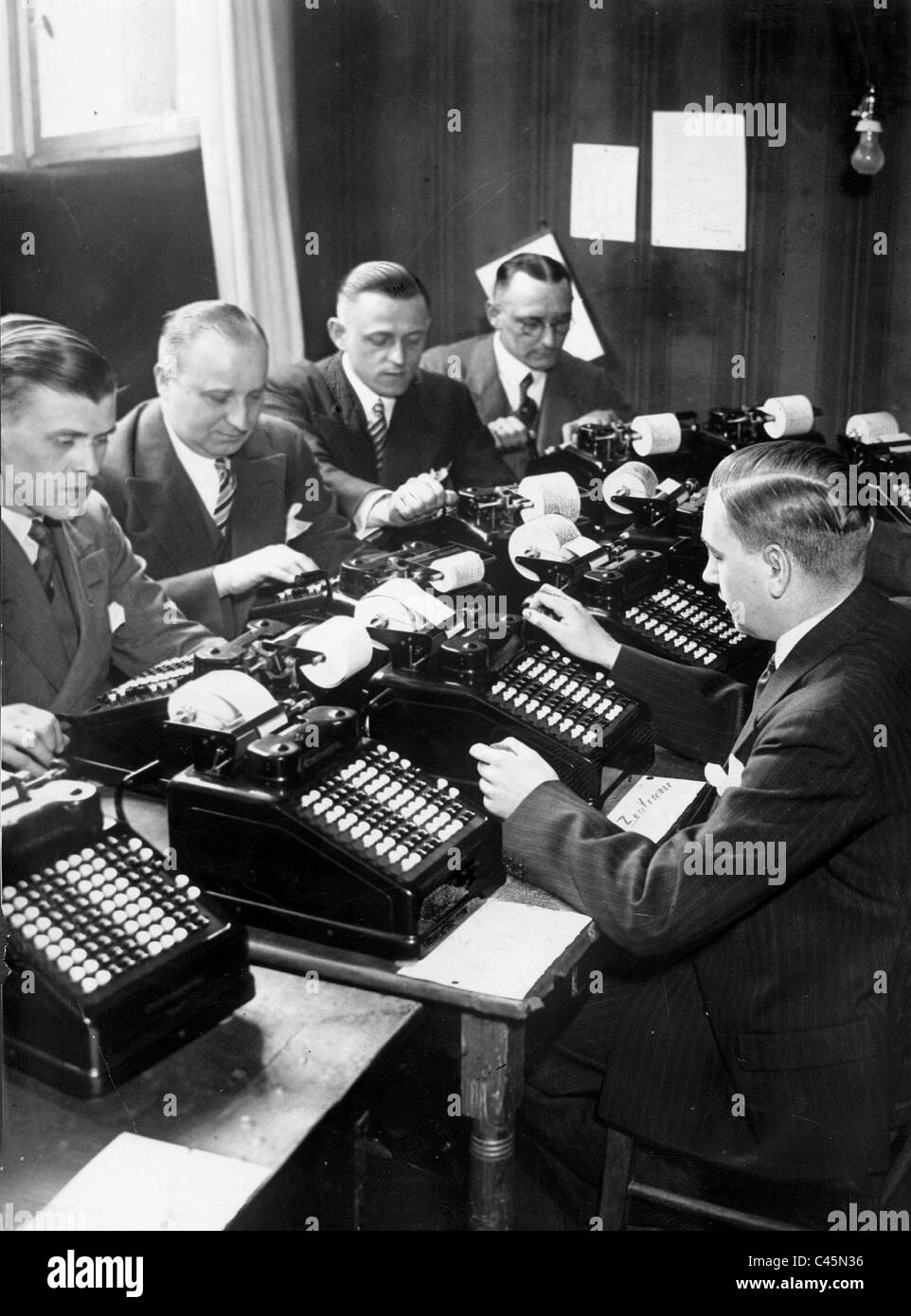Election workers during the count of votes after the Reichstag ...