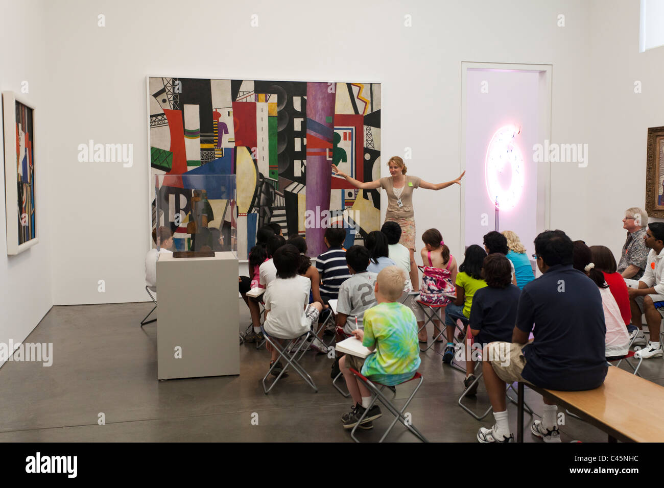animated museum guide lecturing to elementary schoolchildren in ...