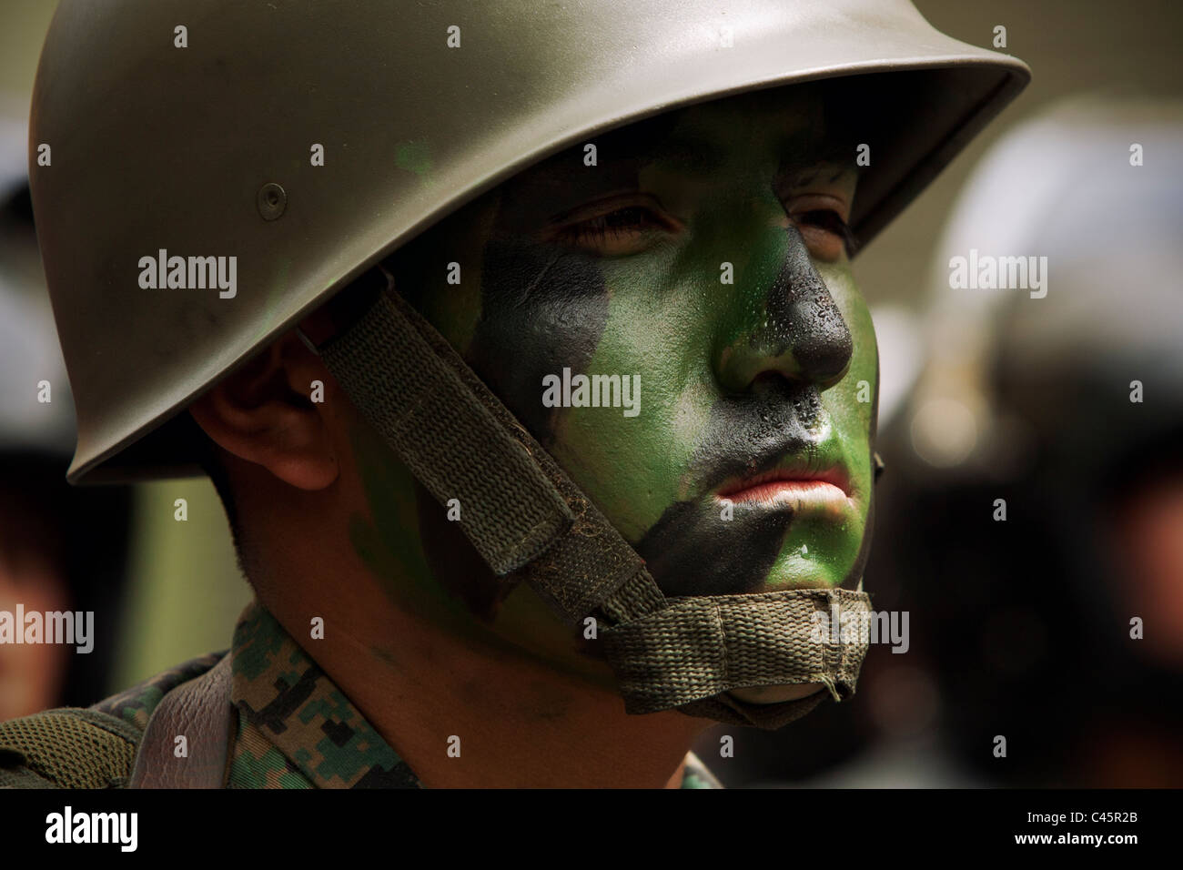 Ecuadorian Soldier With Having His Face Painted In Camouflage Pattern ...