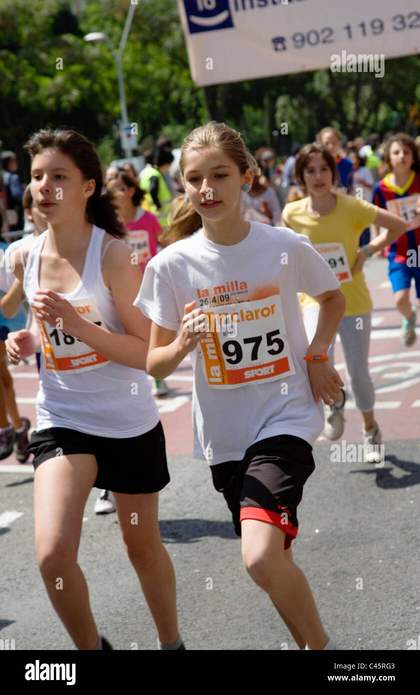 Girls running in organized road race Stock Photo - Alamy