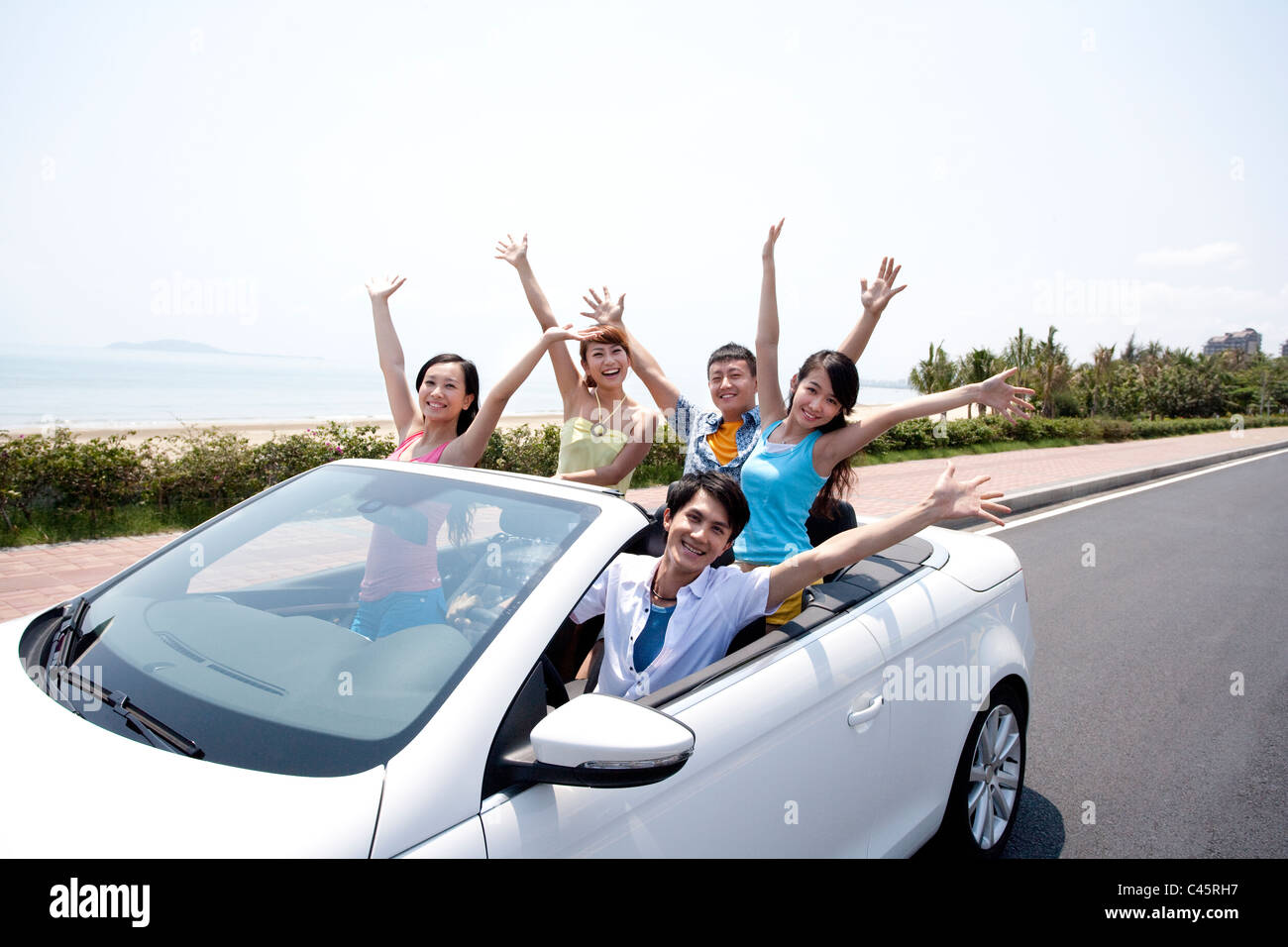 Friends Having Fun in a Convertible Stock Photo - Alamy