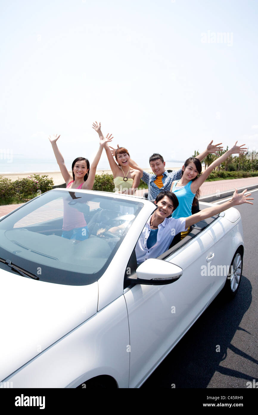 Friends Having Fun in a Convertible Stock Photo - Alamy