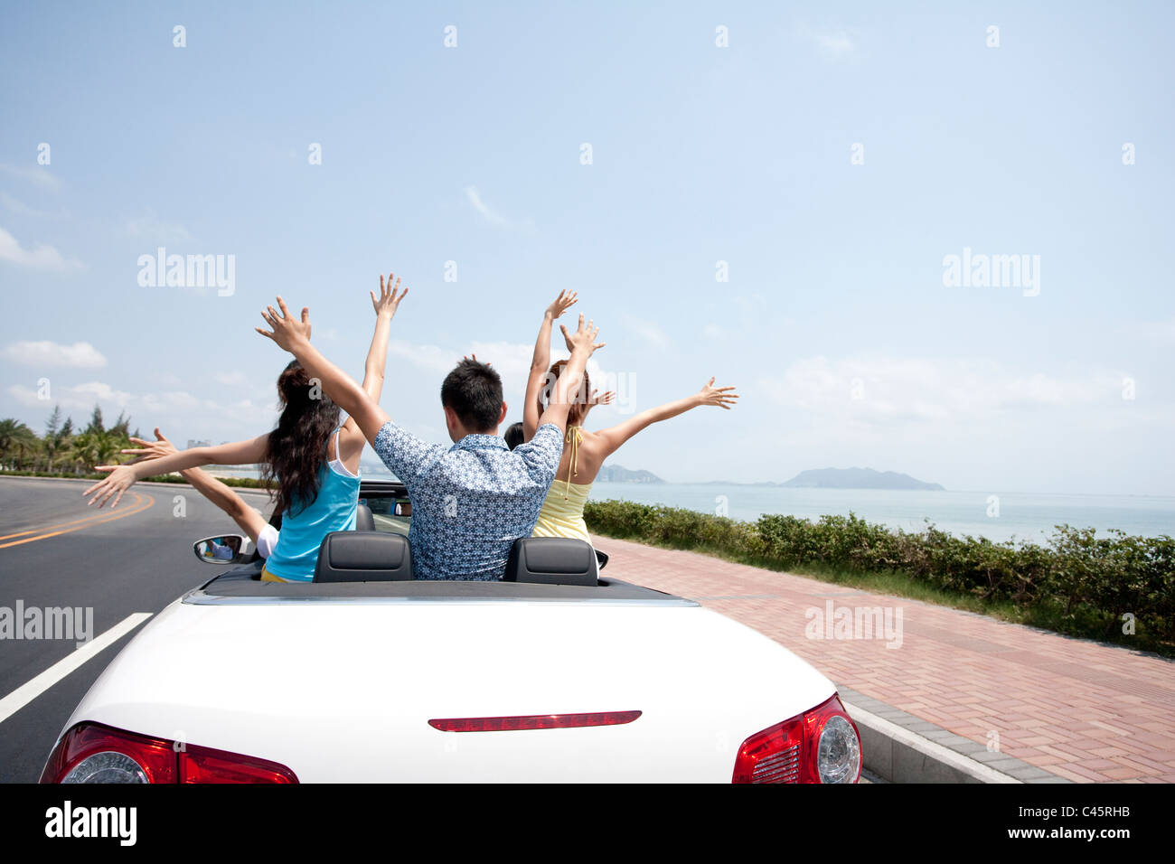 Friends Having Fun in a Convertible Stock Photo - Alamy